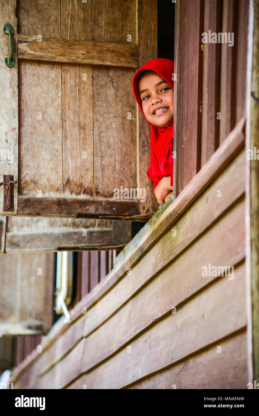 Krabi, Thailand - May 2, 2015: Cute muslim girl wearing red hijap ...