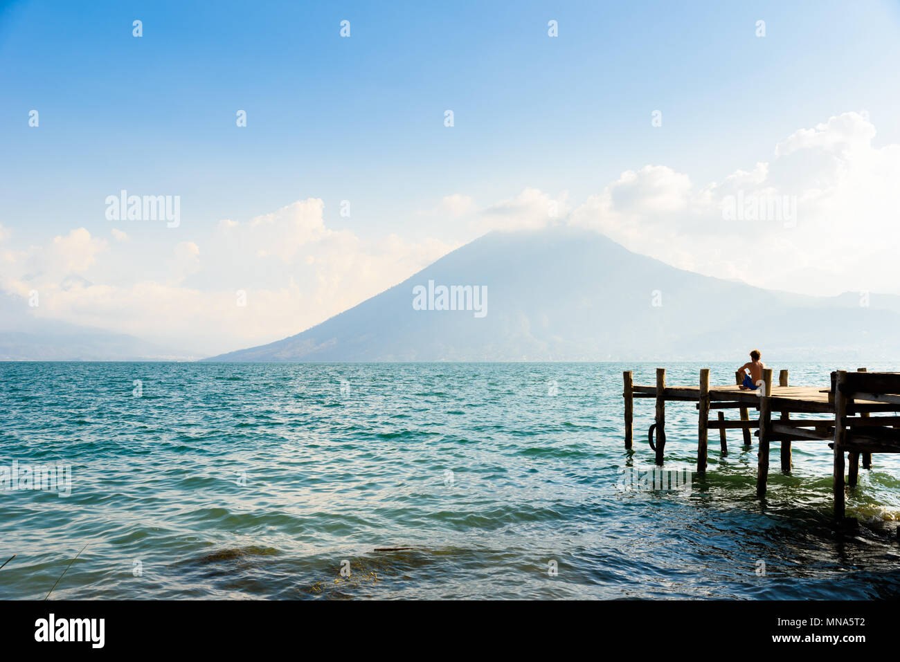 Pier at San Marcos La Laguna with beaufiful scenery of Lake Atitlan and ...