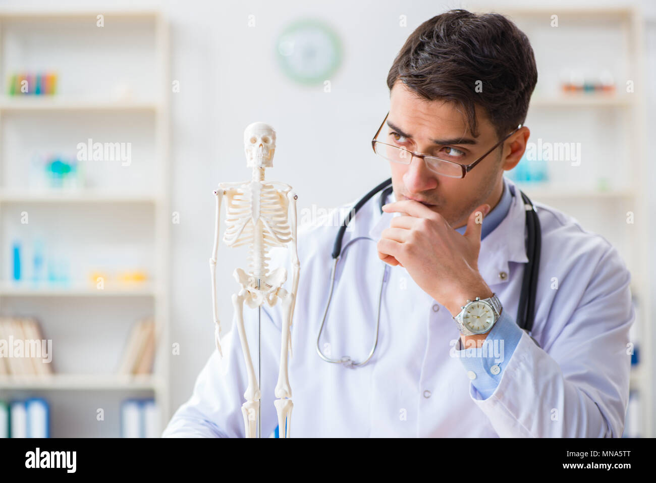 Doctor student studying the bones of skeleton Stock Photo - Alamy