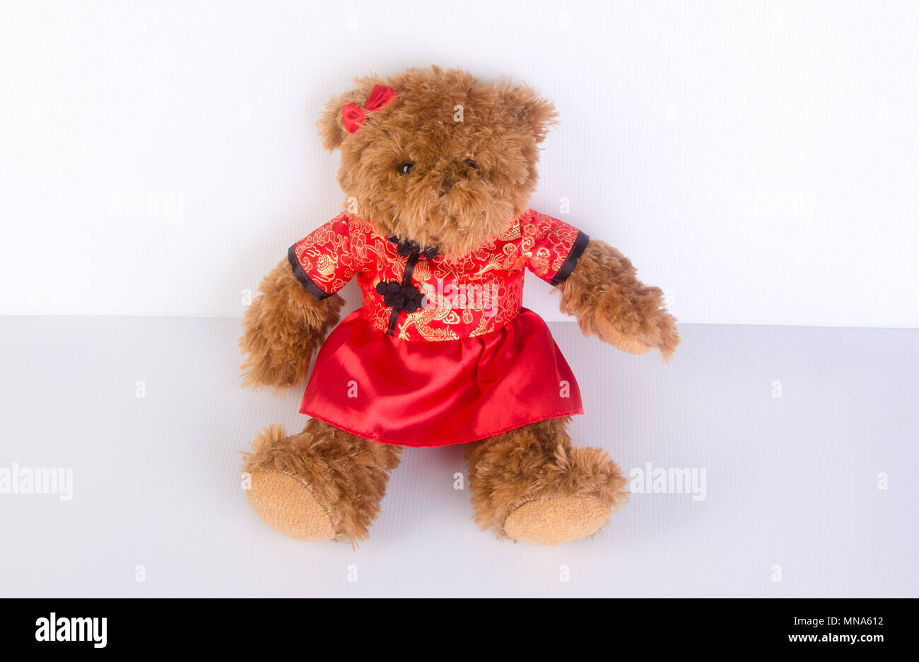 toy or teddy bear with chinese red shirt on background Stock Photo - Alamy