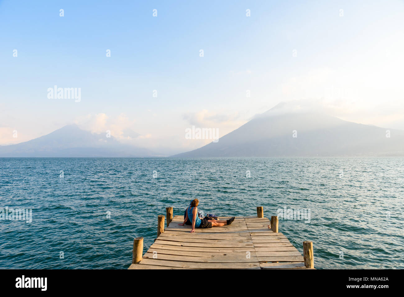 Pier at San Marcos La Laguna with beaufiful scenery of Lake Atitlan and ...