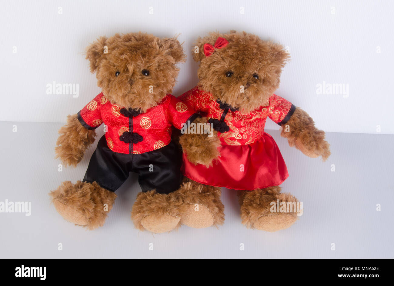 toy or teddy bear with chinese red shirt on background Stock Photo - Alamy