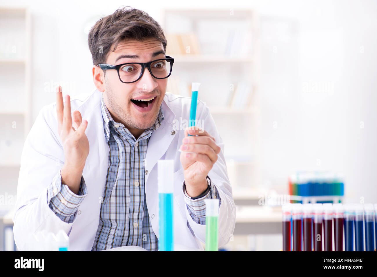 Chemistry student doing chemical experiments at classroom activity ...