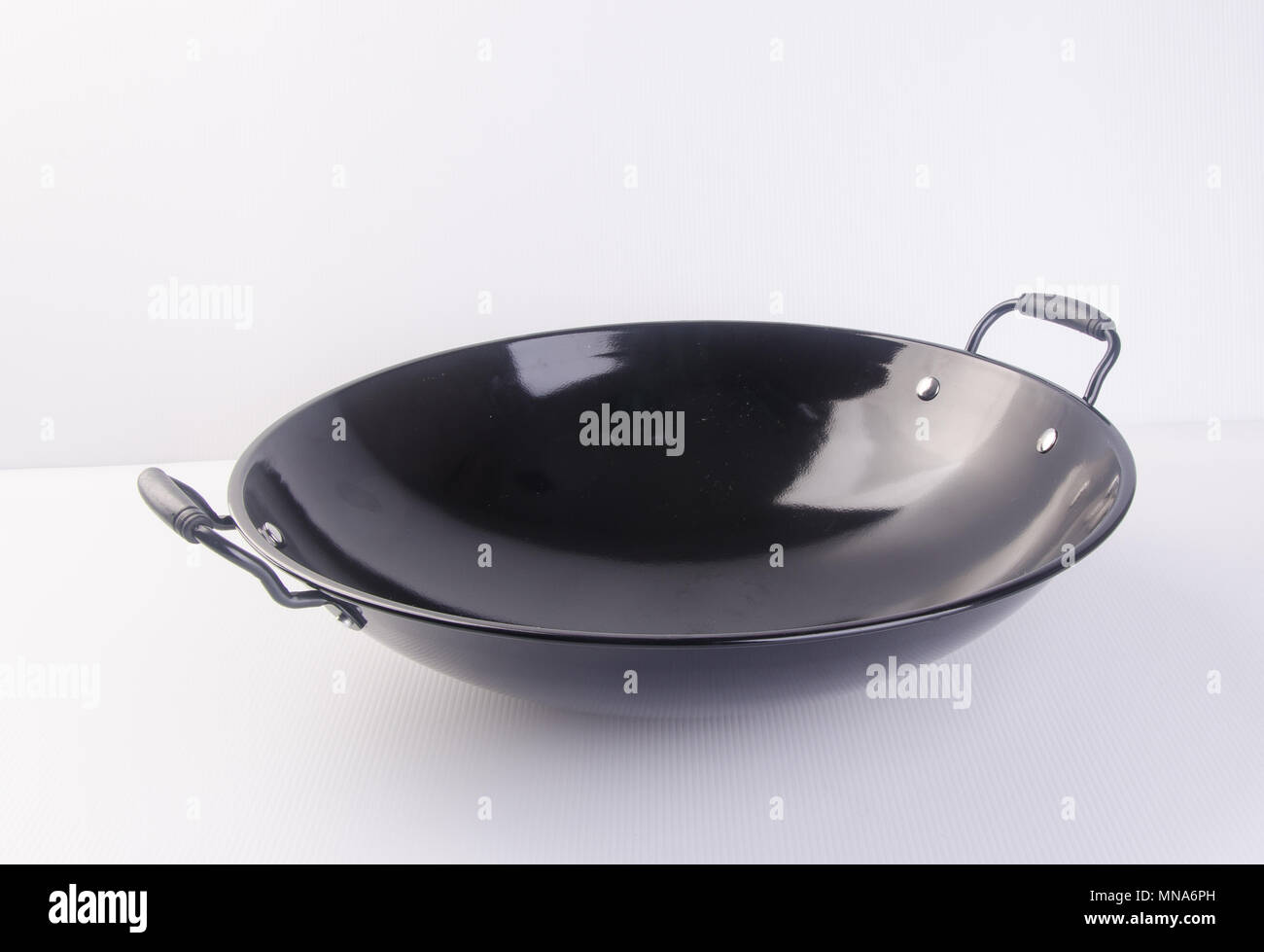 wok or asian cooking wok on a background Stock Photo - Alamy