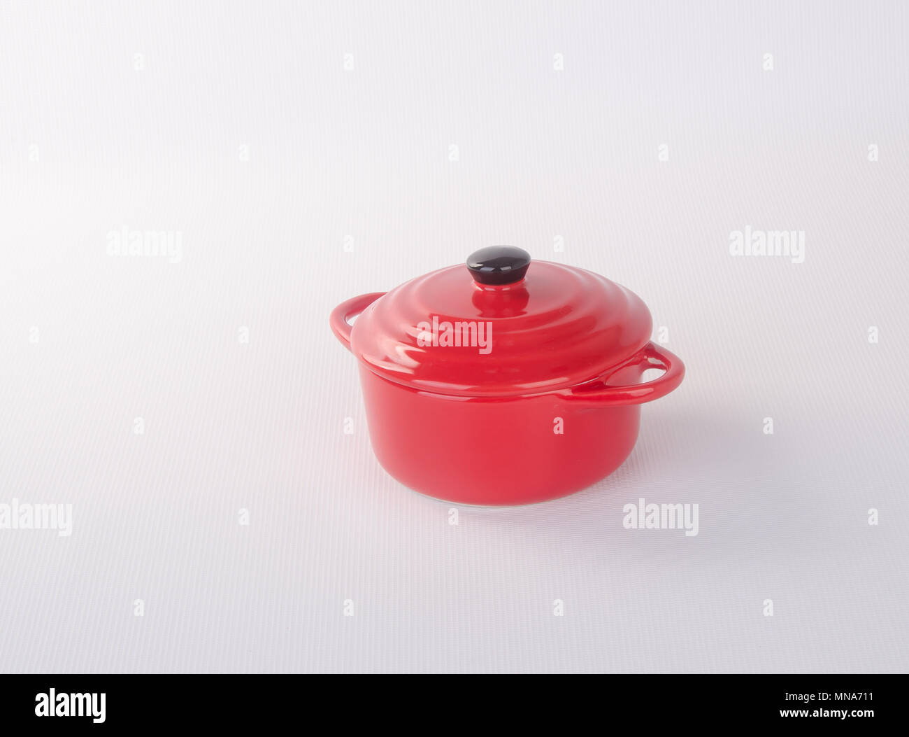 pot or red pot with cover on background Stock Photo - Alamy
