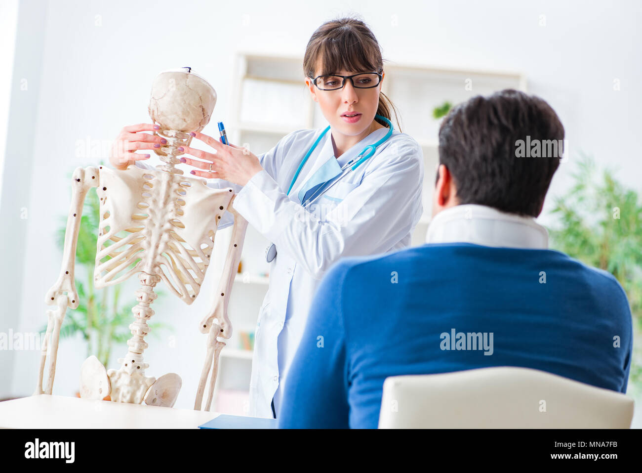 Doctor is explaining to patient with neck injury Stock Photo - Alamy