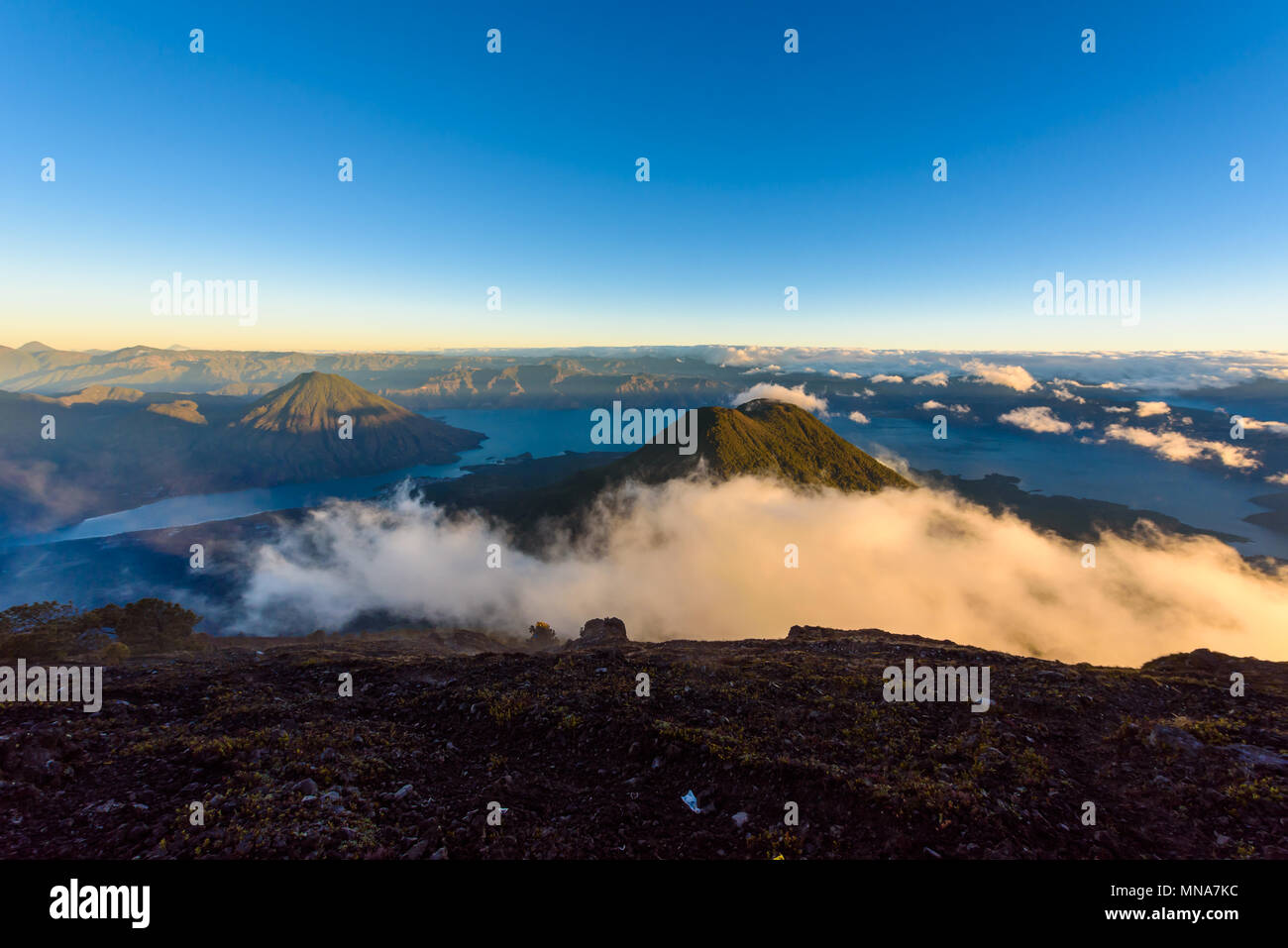 Panorama view of Lake Atitlan and volcano San Pedro and Toliman early ...