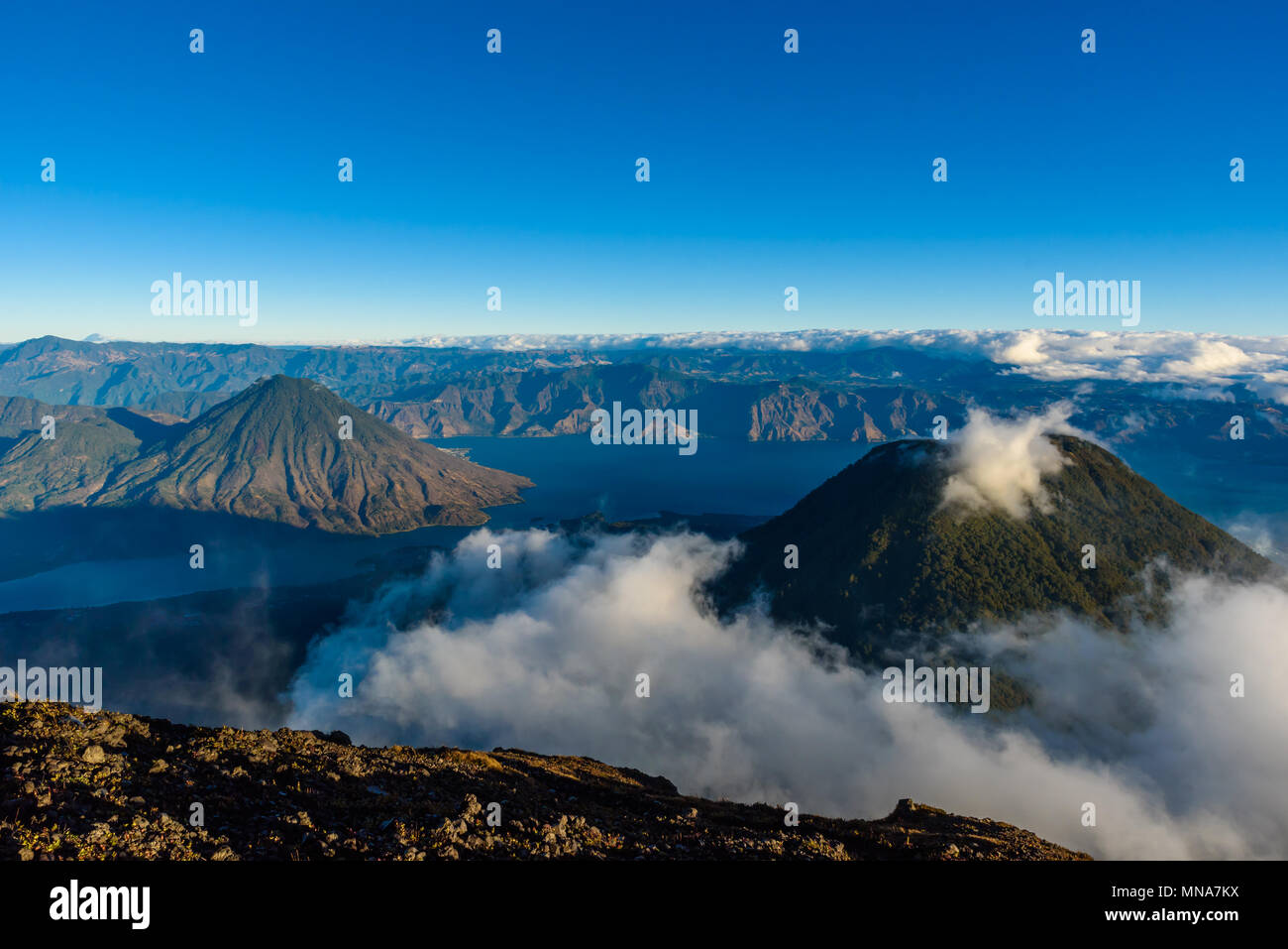 Panorama view of Lake Atitlan and volcano San Pedro and Toliman early ...