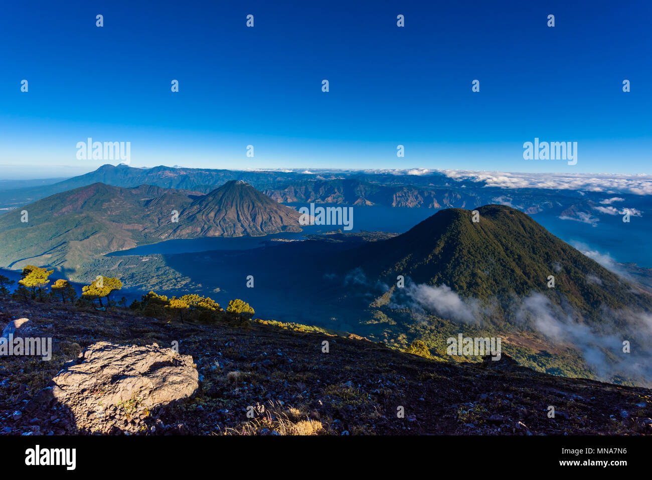 Panorama view of Lake Atitlan and volcano San Pedro and Toliman early ...