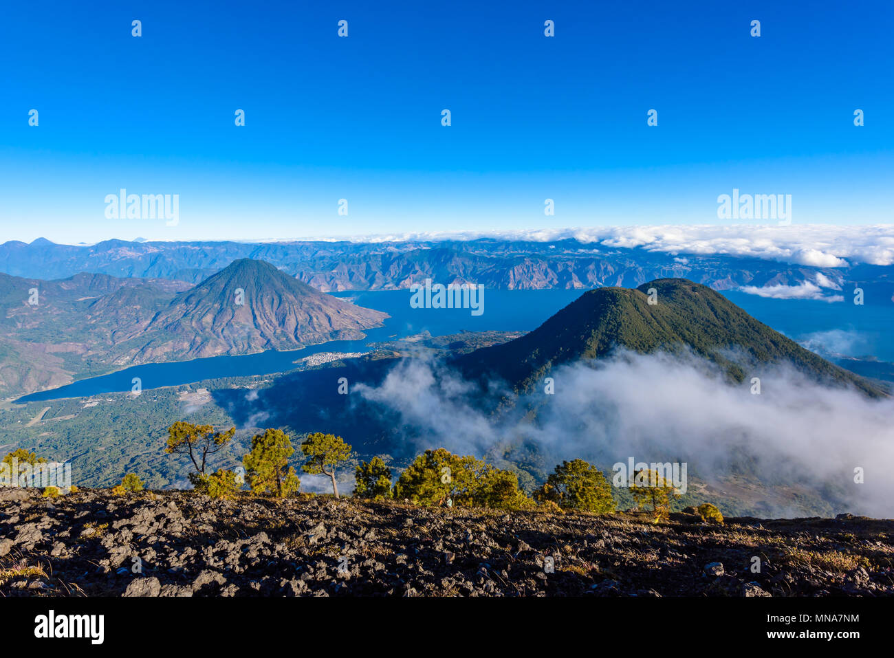 Panorama view of Lake Atitlan and volcano San Pedro and Toliman early ...