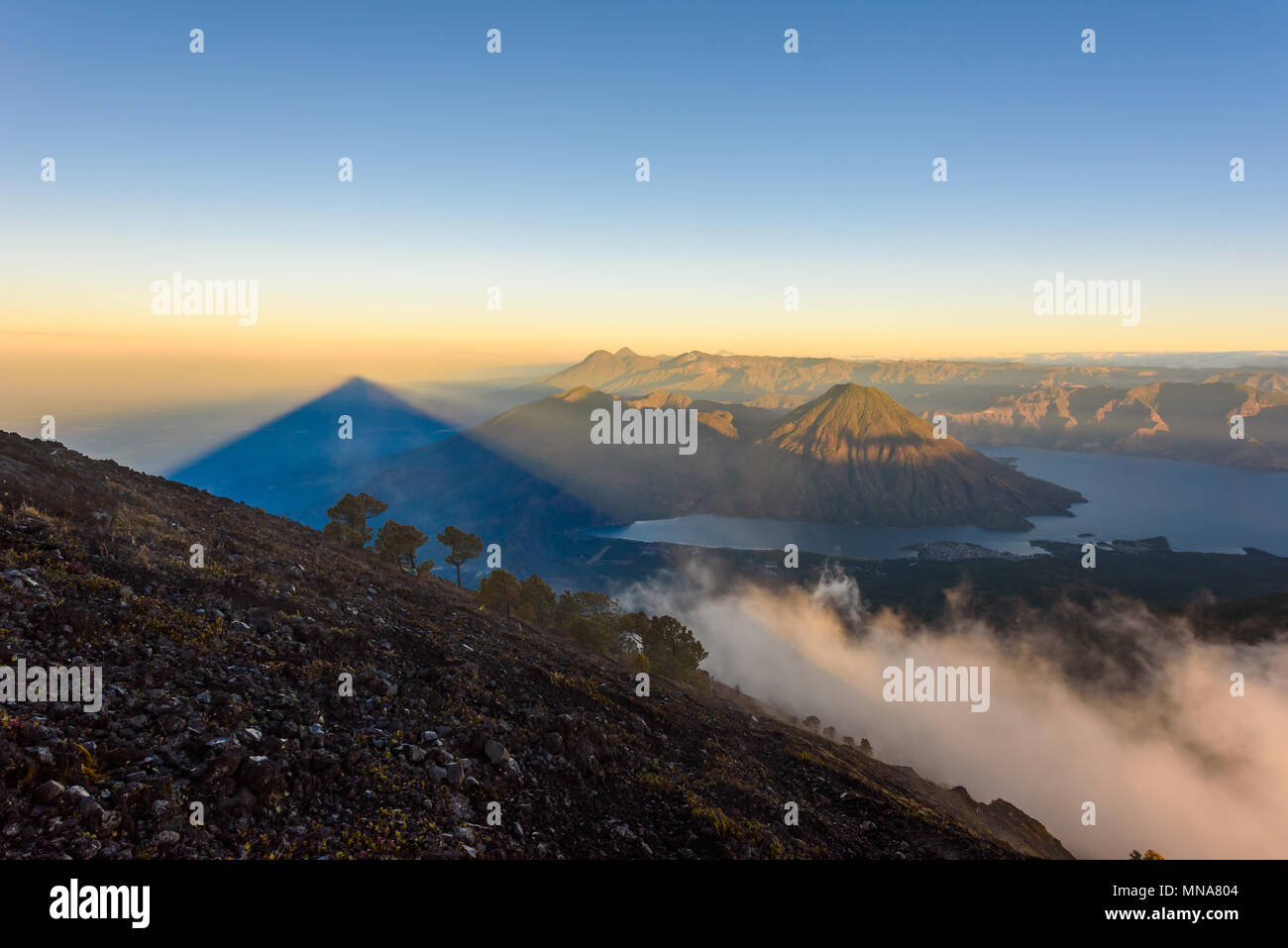 Panorama view of Lake Atitlan and volcano San Pedro early in the ...