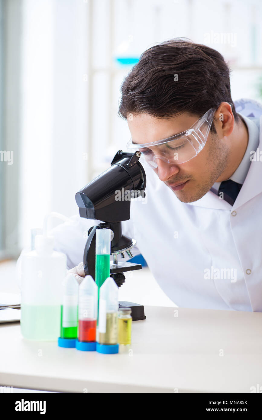 Male biochemist working in the lab on plants Stock Photo - Alamy
