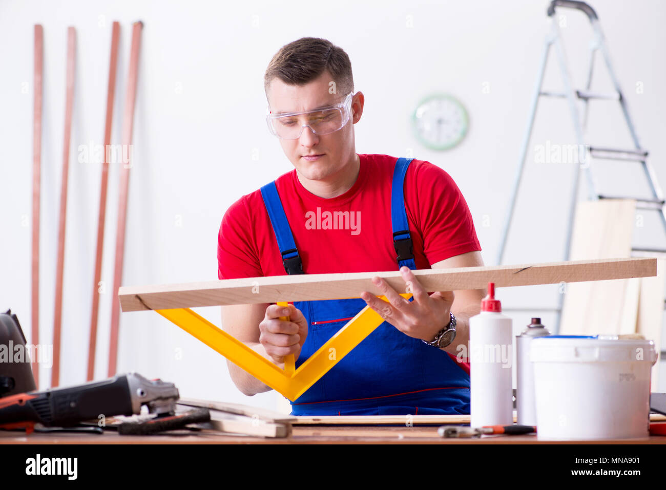Contractor working in the workshop Stock Photo - Alamy