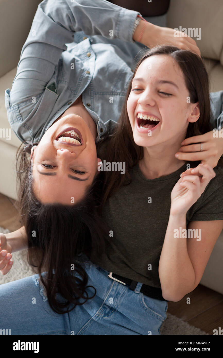 Two sisters have fun in the room Stock Photo - Alamy