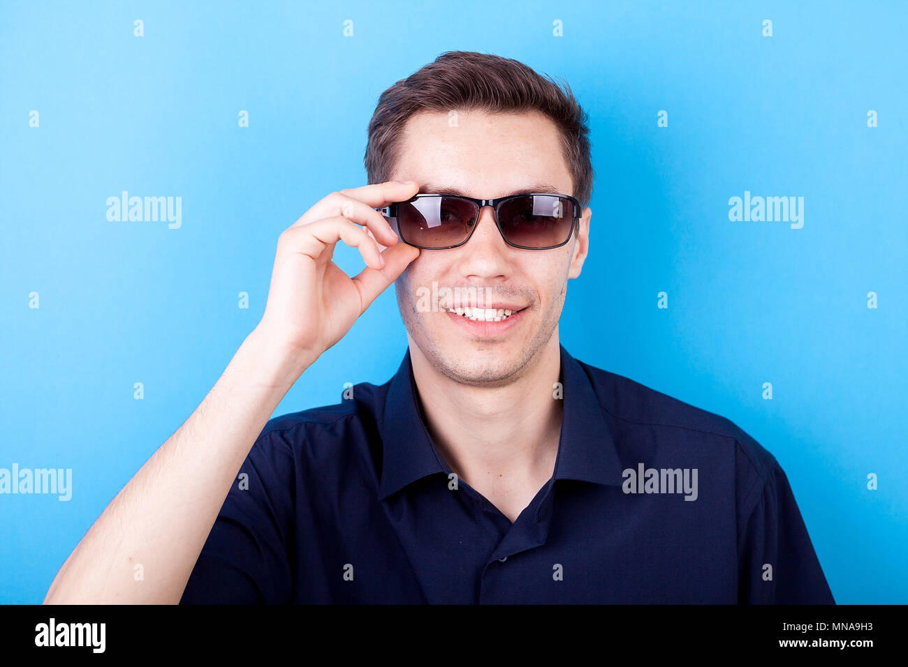 Wearing blue casual shirt for men hi-res stock photography and images ...