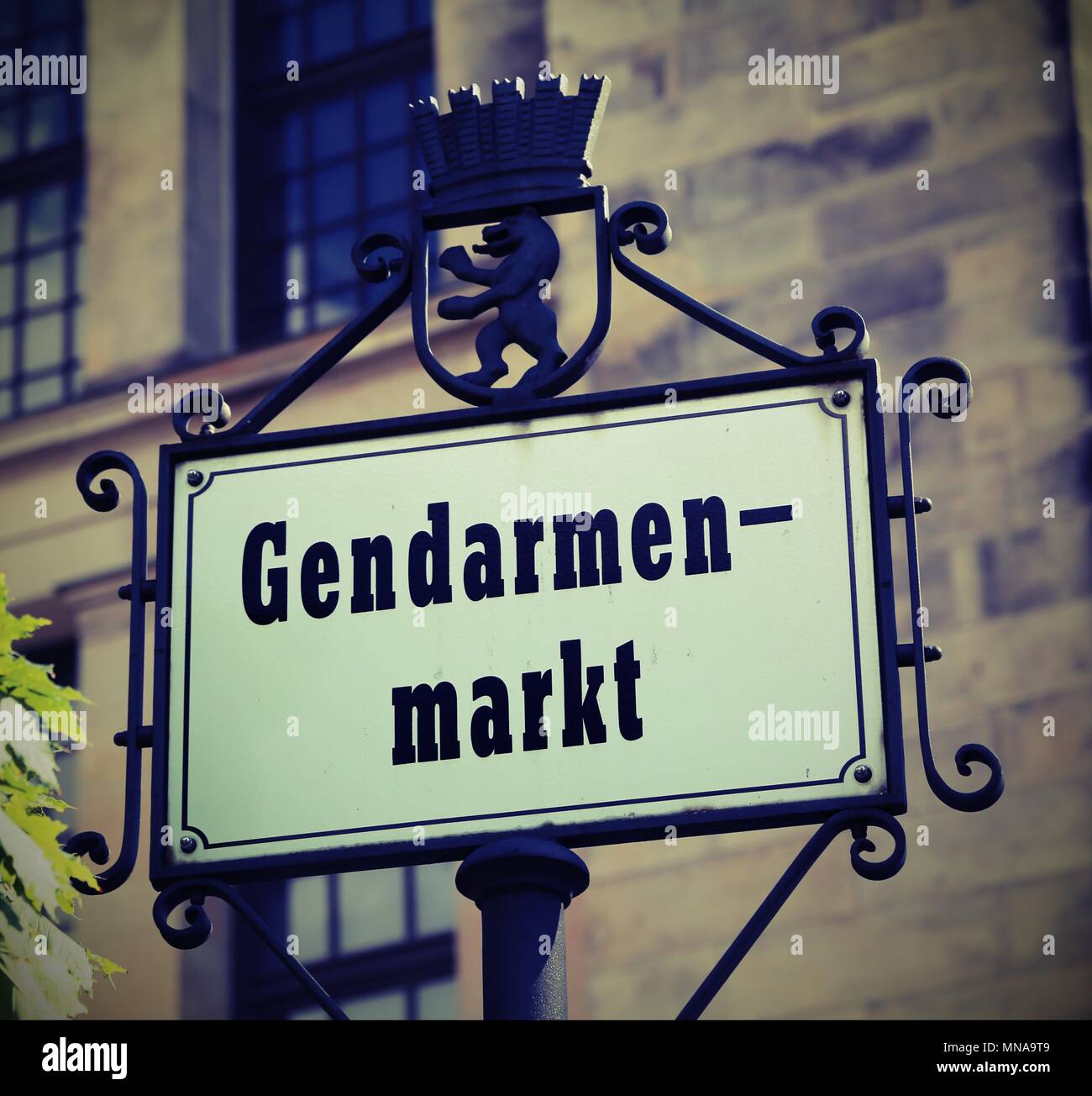 square of Berlin in the road sign called Gendarmenmarkt that means ...