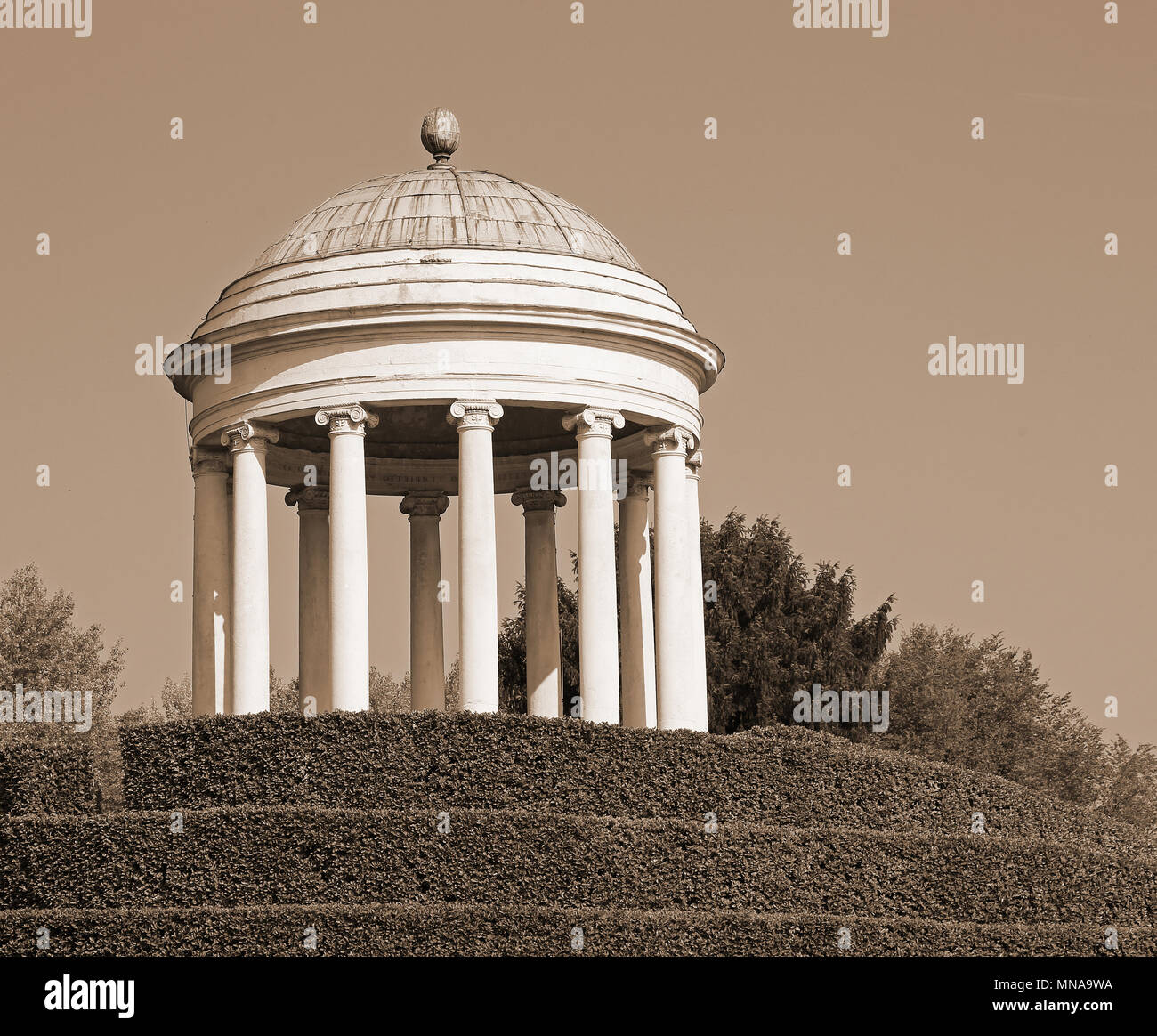 neoclassical dome over the hill and the blue sky with sepia toned ...