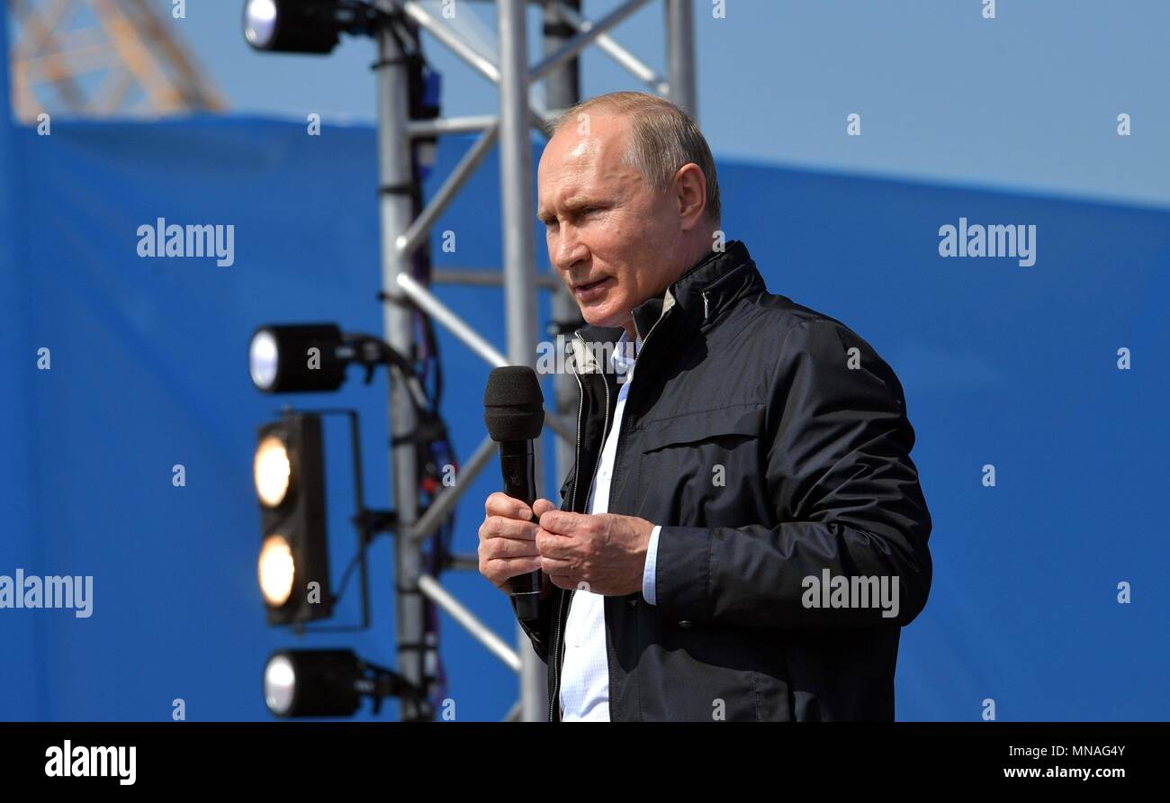 Russian President Vladimir Putin addresses workers and officials during ...
