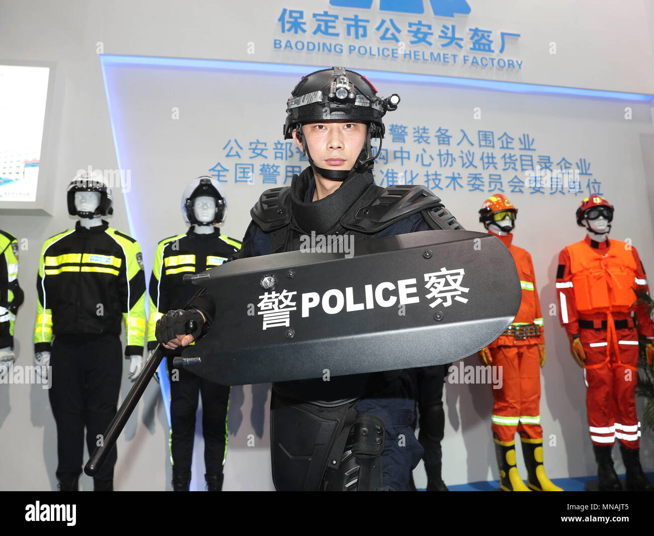 Beijing, China. 15th May, 2018. An exhibitor shows riot gear for police ...