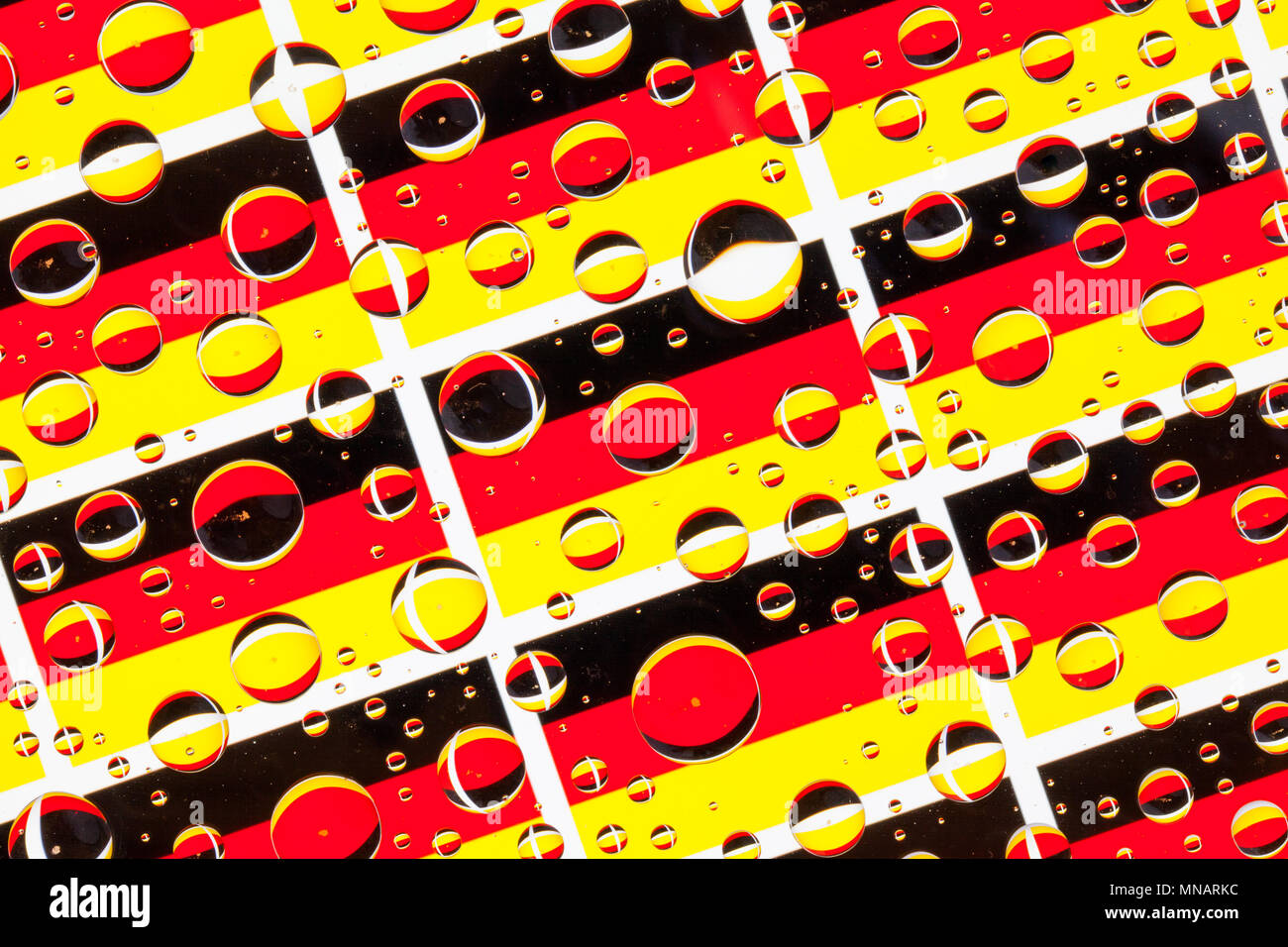 Flags of Germany, behind a glass covered with rain drops.Pattern from ...