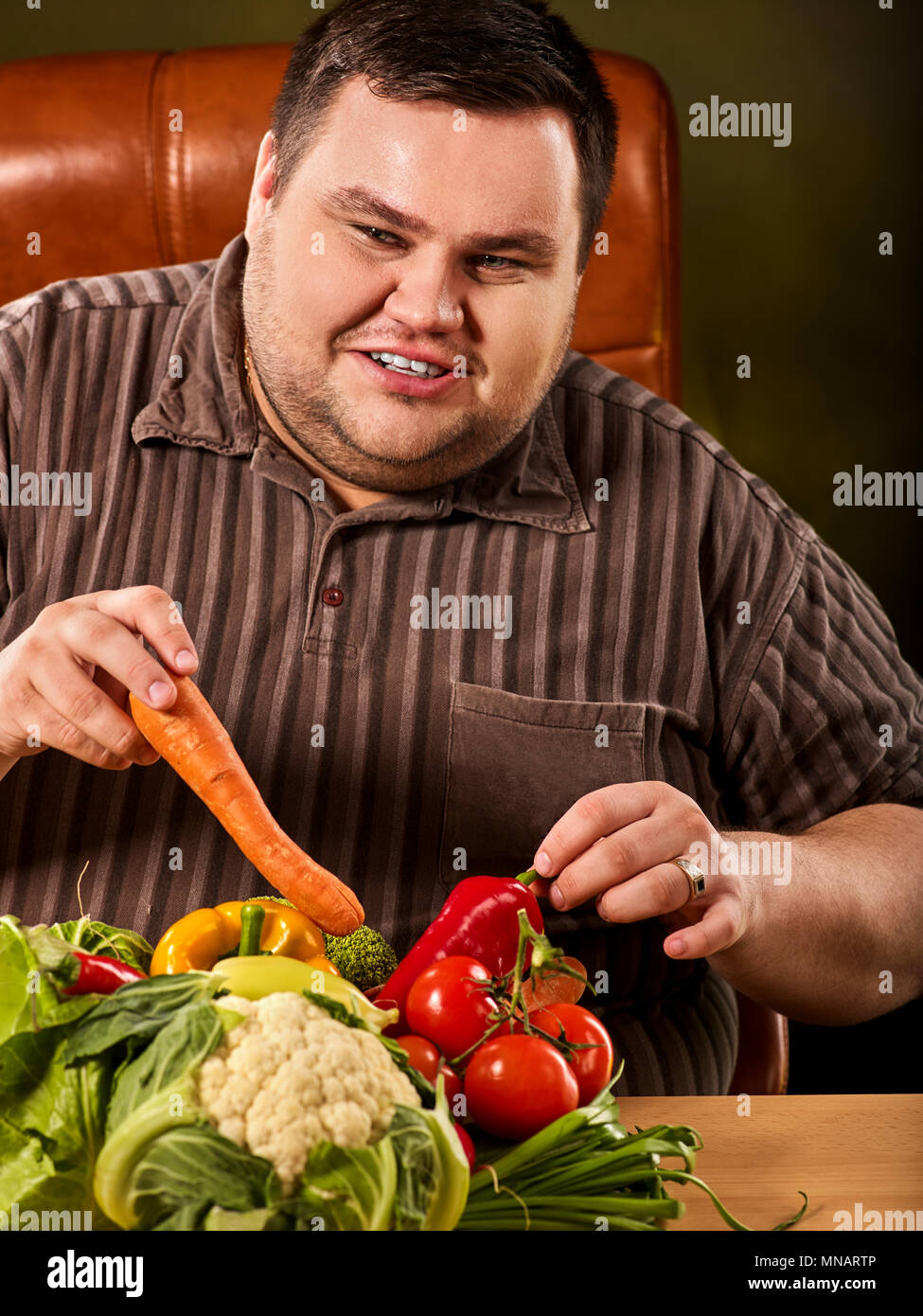 Diet fat man eating healthy food. Healthy breakfast with vegetables ...