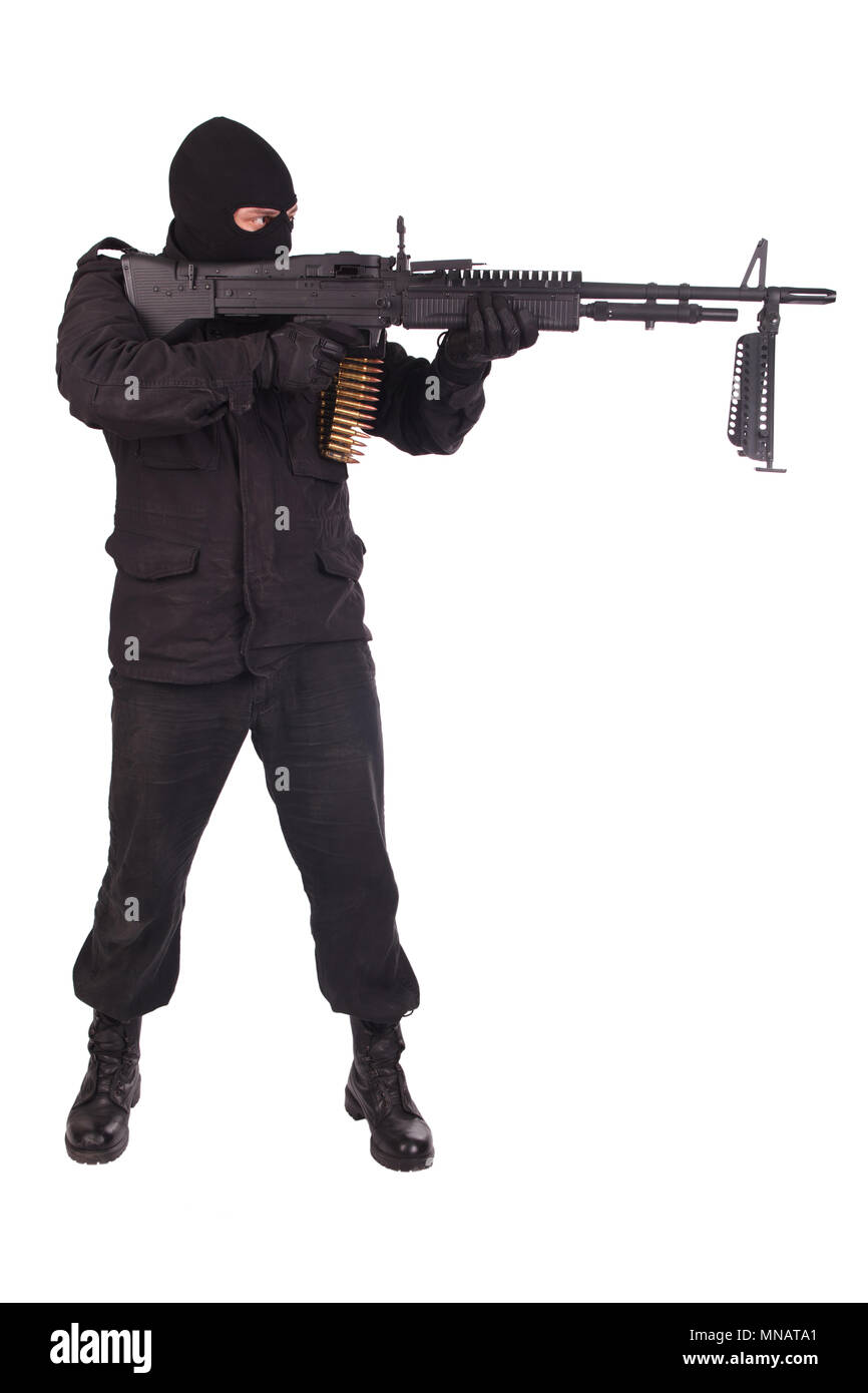 mercenary in black uniforms with machine gun Stock Photo - Alamy