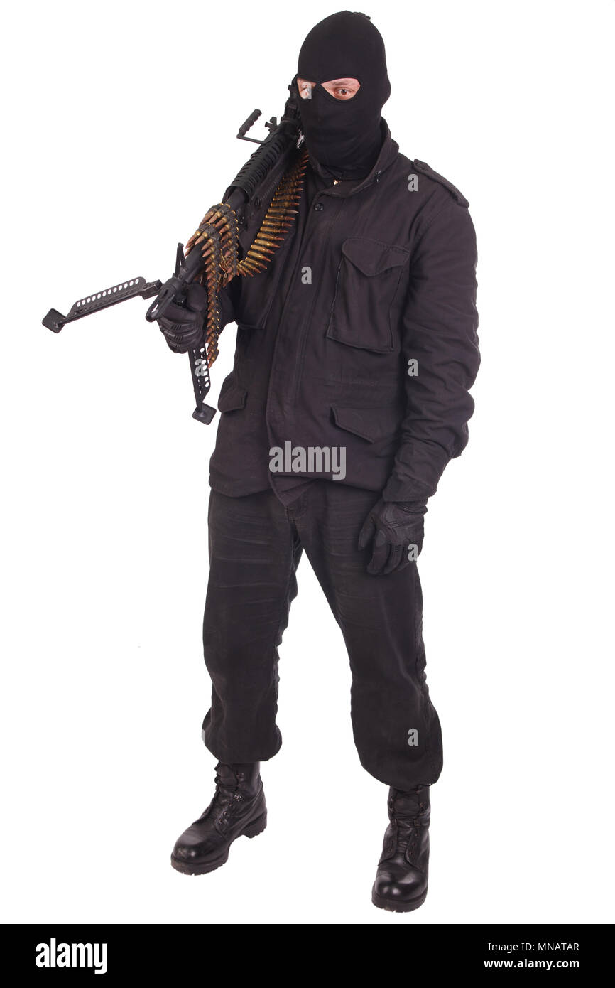 mercenary in black uniforms with machine gun Stock Photo - Alamy