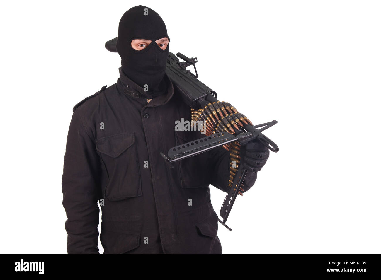 mercenary in black uniforms with machine gun Stock Photo - Alamy