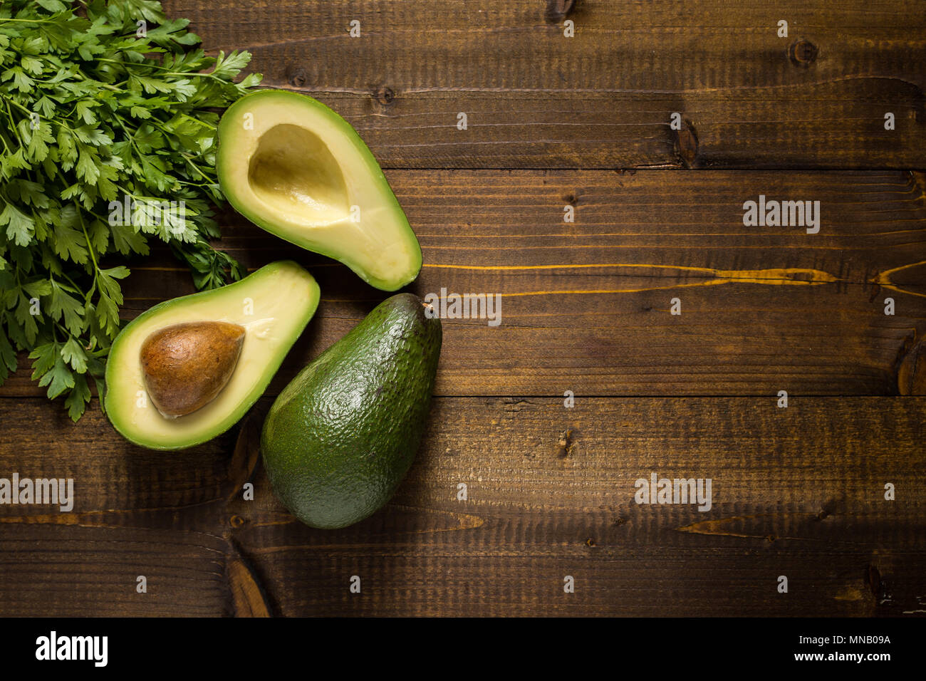 Avocado on Dark Wood Background. Healthy Food Concept Stock Photo - Alamy