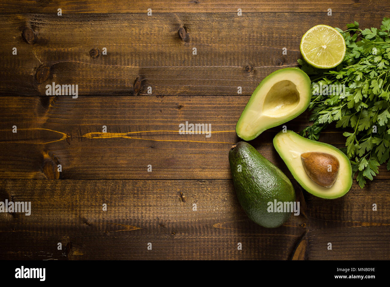 Avocado on Dark Wood Background. Healthy Food Concept Stock Photo - Alamy