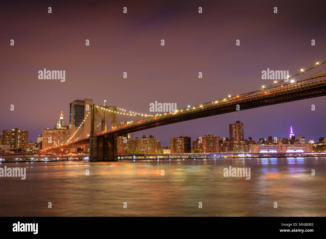 Brooklyn Bridge over hudson river in New York City at sunset Stock Photo - Alamy