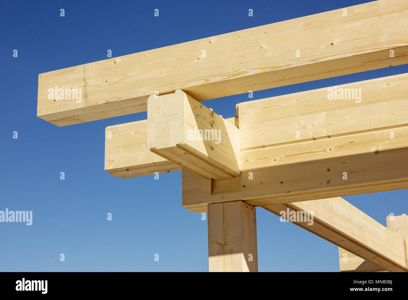 Construction of a wooden beam. Assembling. Angle of log house Stock ...