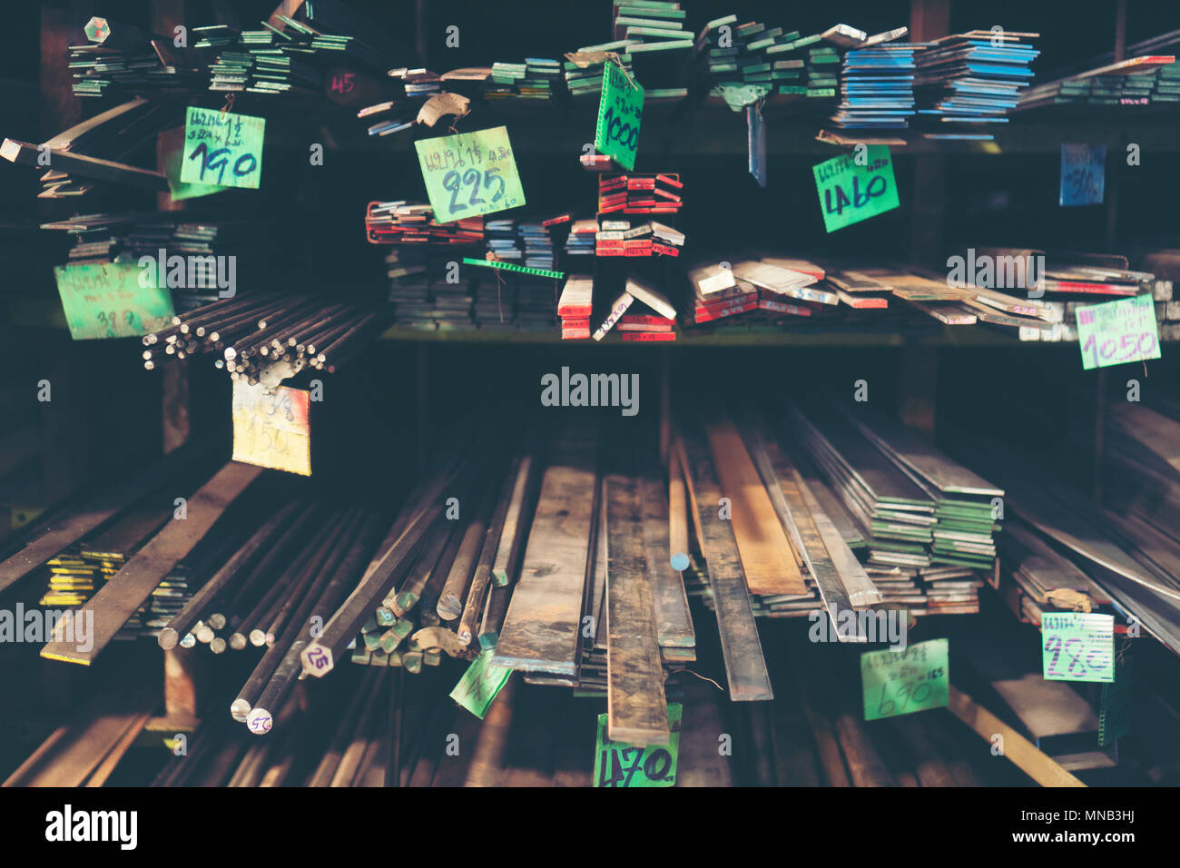 Stack of steel pipes in metal factory shop Stock Photo - Alamy
