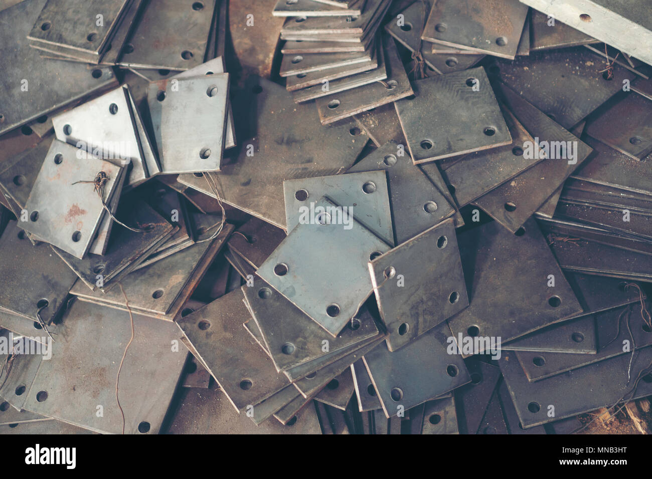 Stack of steel pipes in metal factory shop Stock Photo - Alamy