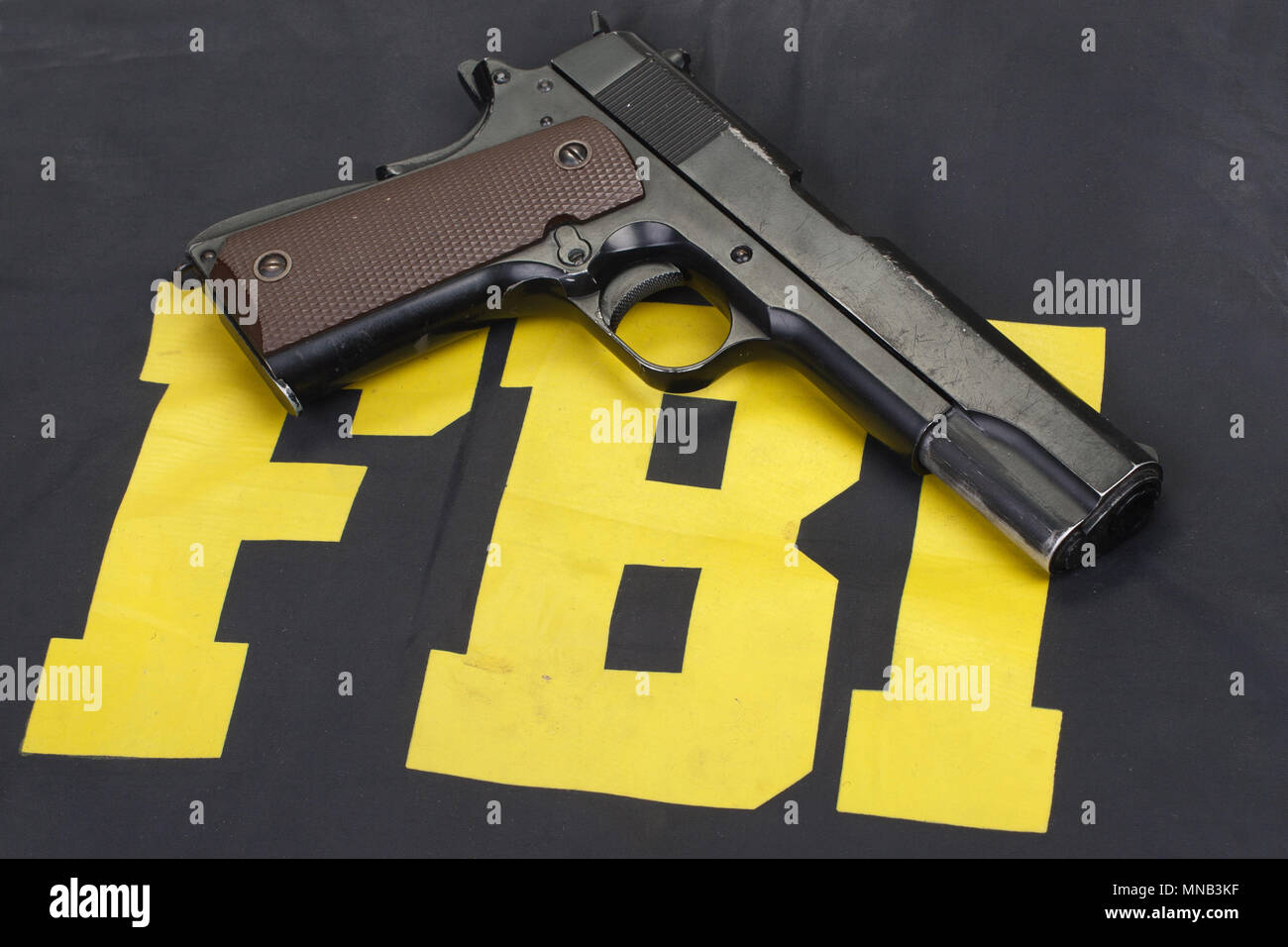 colt government m1911 handgun on fbi uniform Stock Photo - Alamy