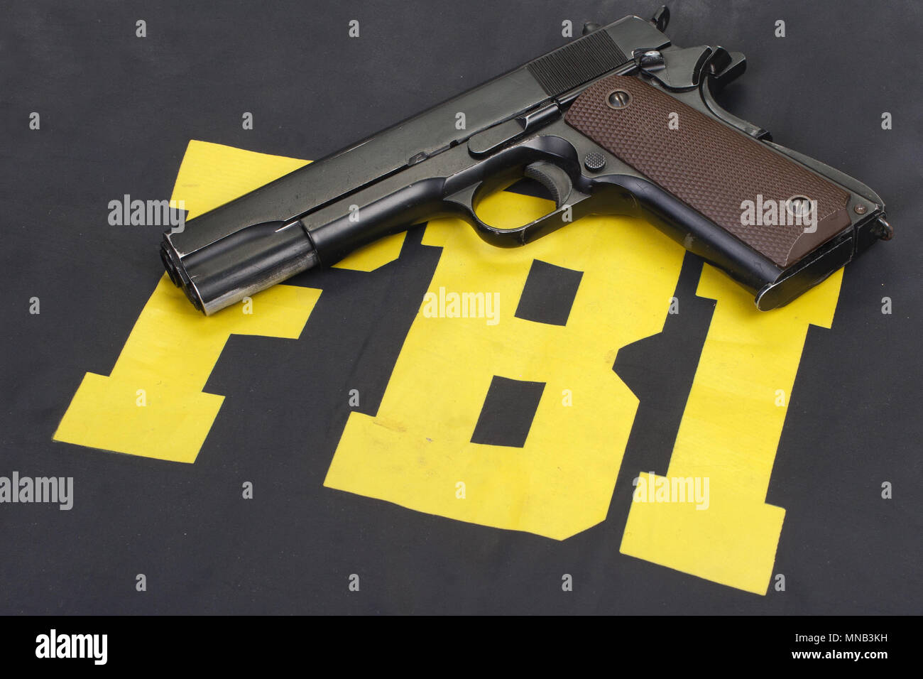 colt government m1911 handgun on fbi uniform Stock Photo - Alamy