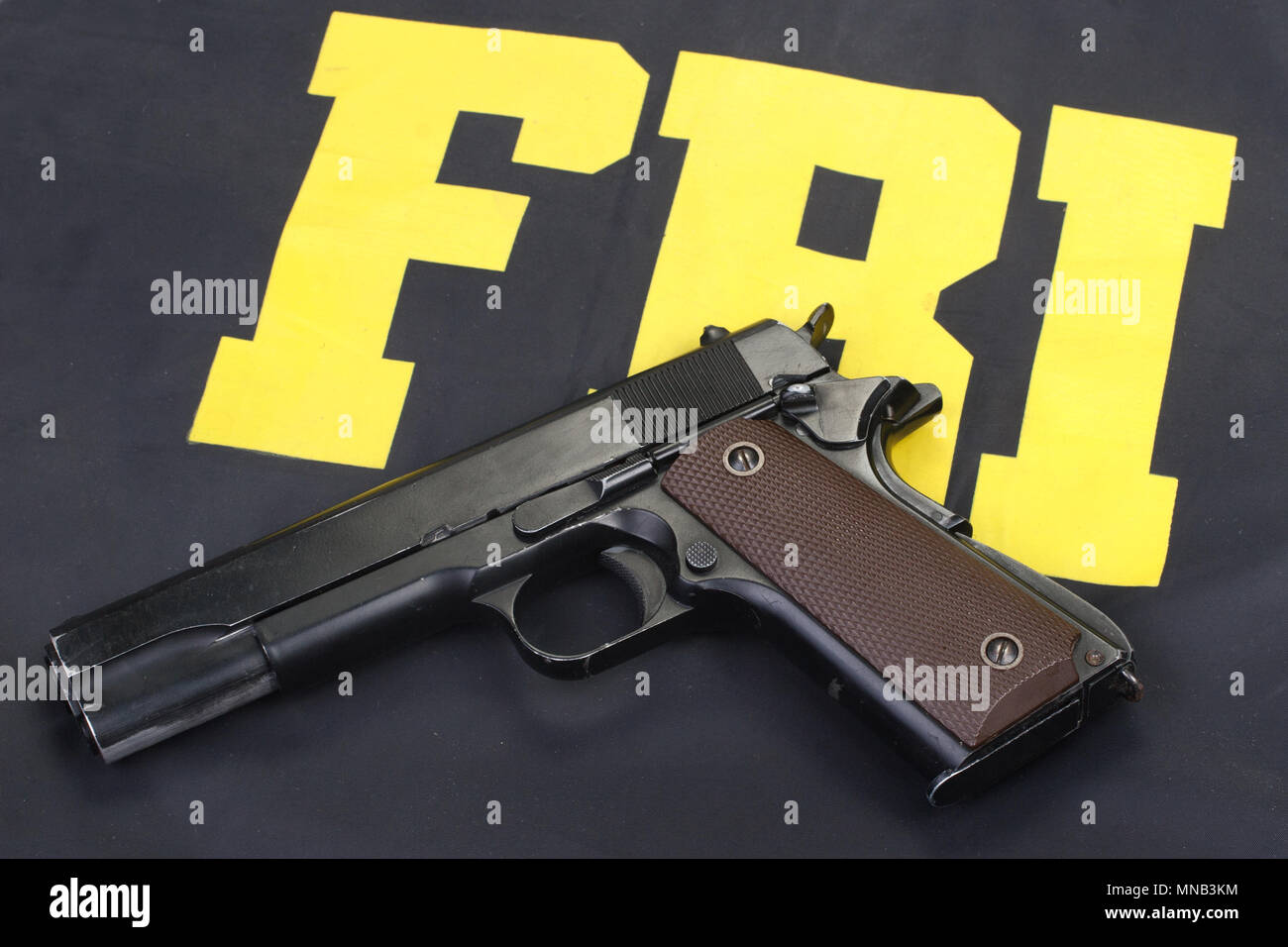 colt government m1911 handgun on fbi uniform Stock Photo - Alamy