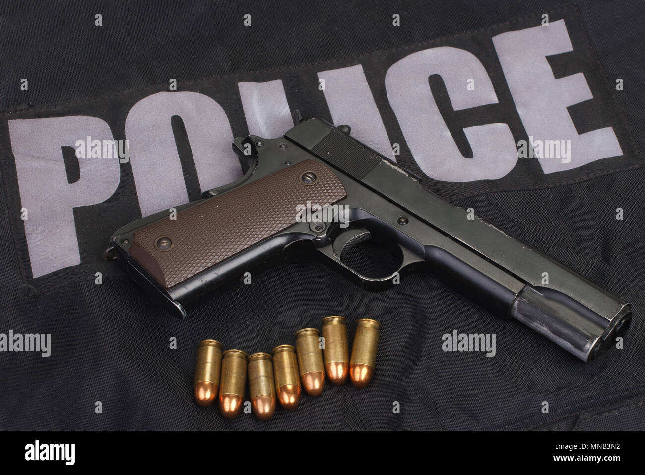 colt government m1911 handgun with ammo on police uniform Stock Photo ...