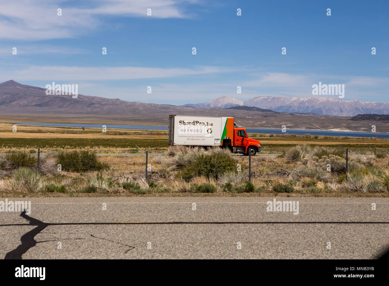 A big rig truck traveling South on Highway 395 with Crowley lake ...
