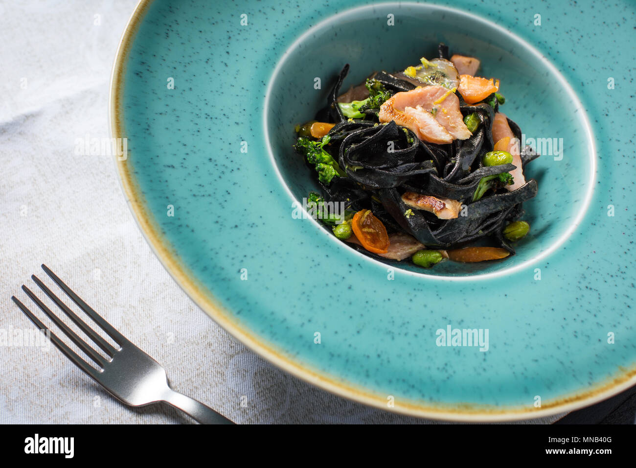 Cuttlefish Ink Black Spaghetti with Salmon and Vegetables Stock Photo ...
