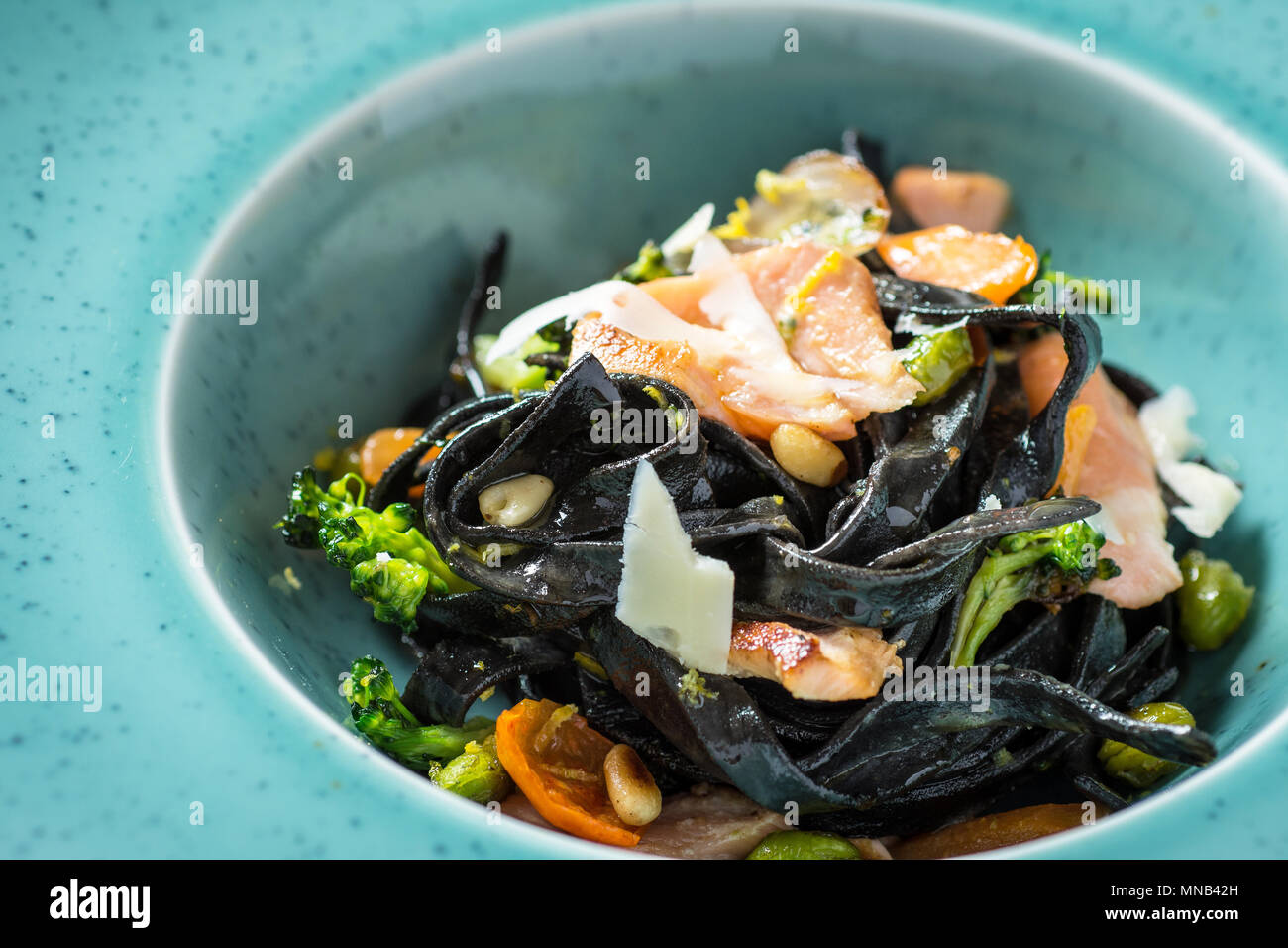 Cuttlefish Ink Black Spaghetti with Salmon and Vegetables Stock Photo ...