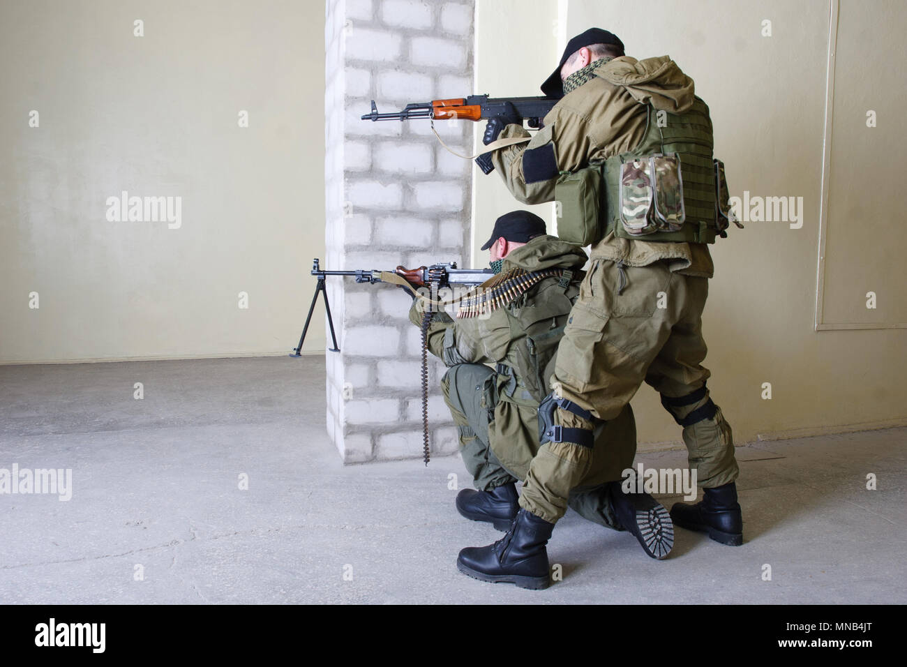 rebels with AK 47 and machine gun inside the building Stock Photo - Alamy