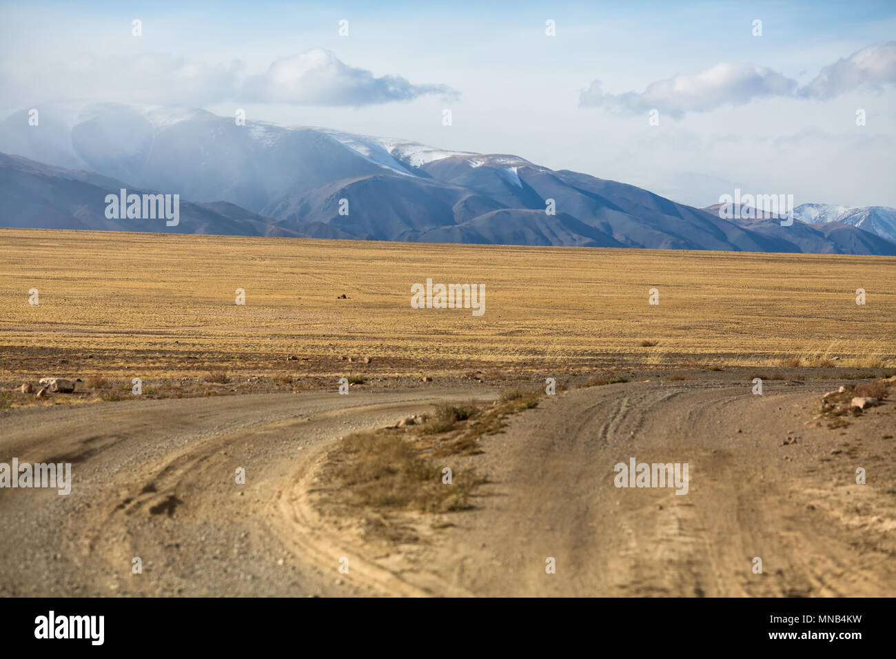 Country road through the steppe and mountains of Western Mongolia Stock ...