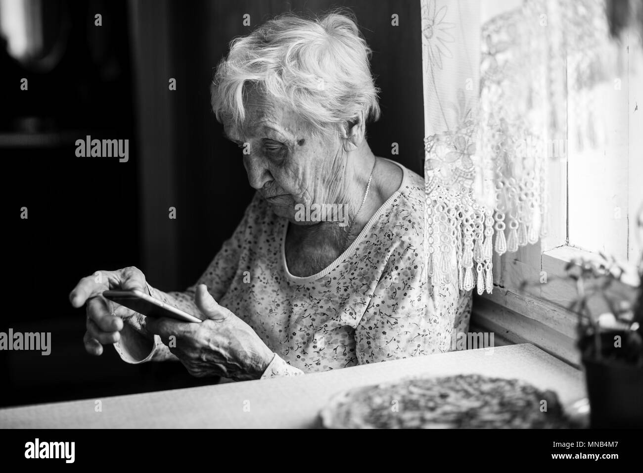 Mature woman hands face smile Black and White Stock Photos & Images - Alamy