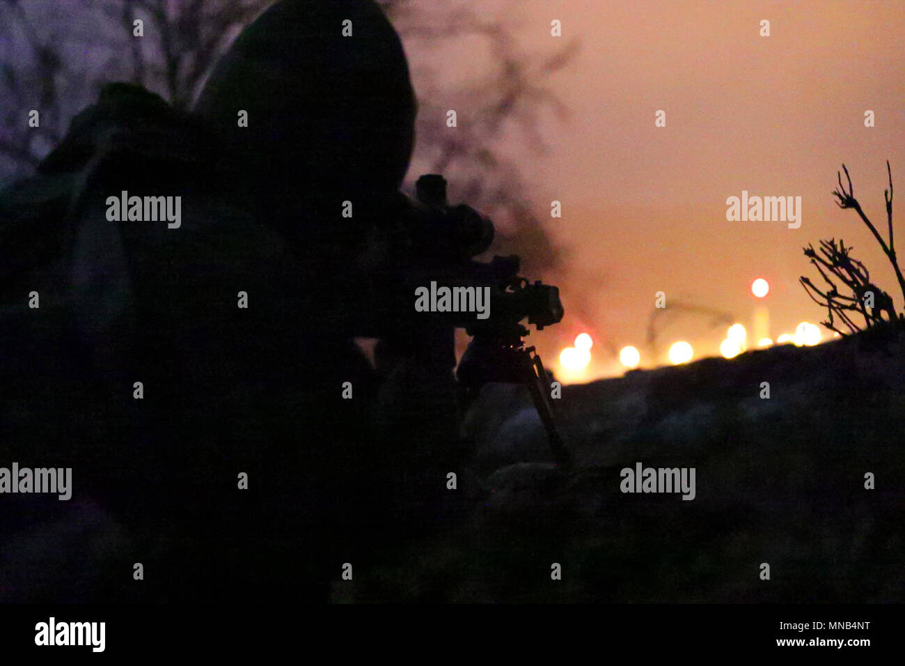 A Lithuanian National Defence Volunteer Forces (KASP) sniper observes ...