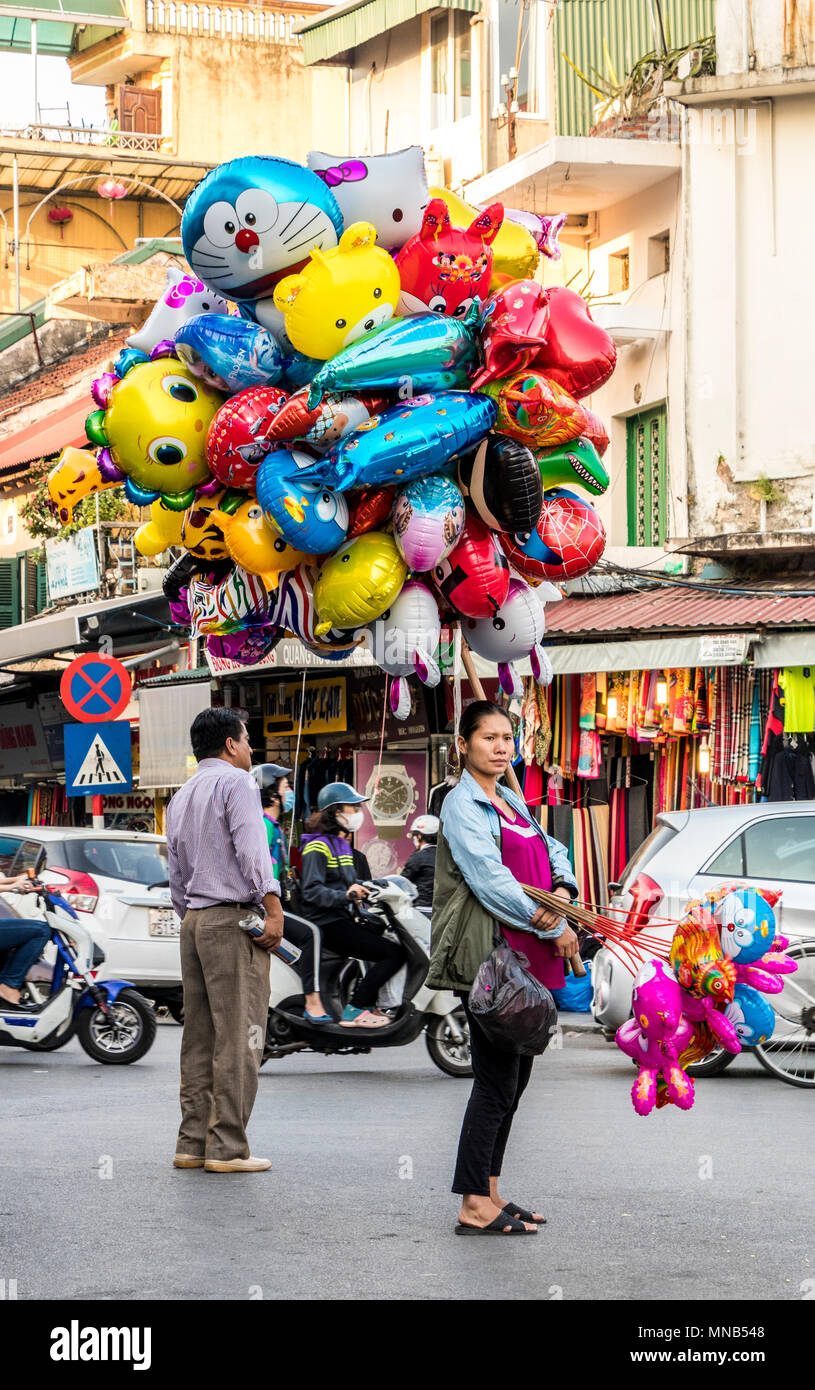 Balloon seller on streets of Hanoi Vietnam Stock Photo - Alamy