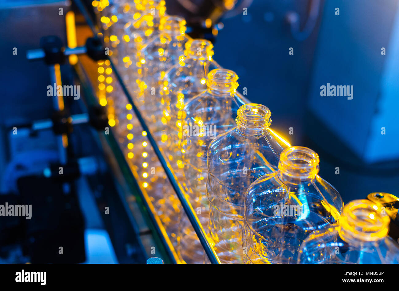 Bottle. Industrial production of plastic pet bottles. Factory line for manufacturing ...