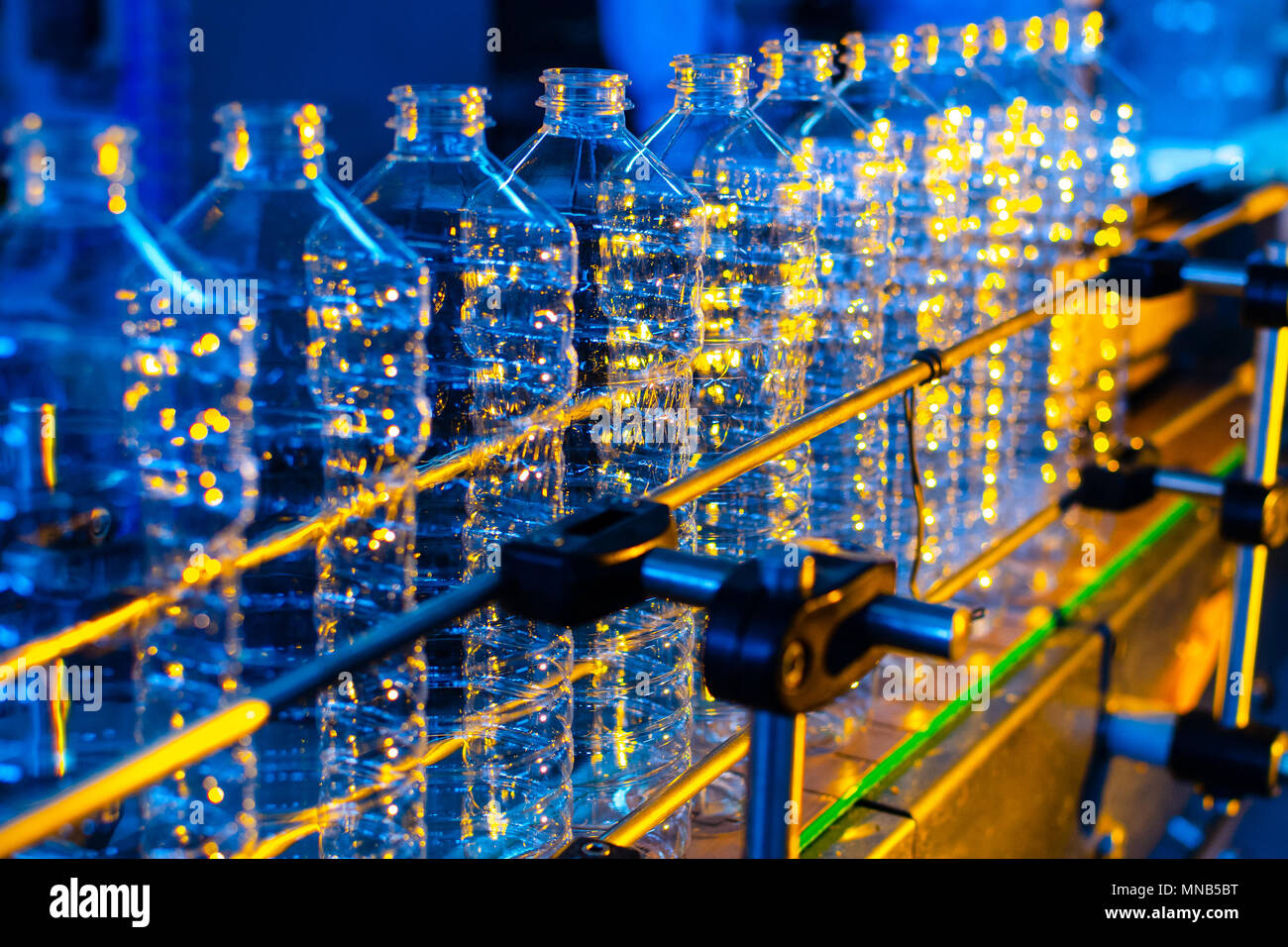 Bottle. Industrial production of plastic pet bottles. Factory line for ...