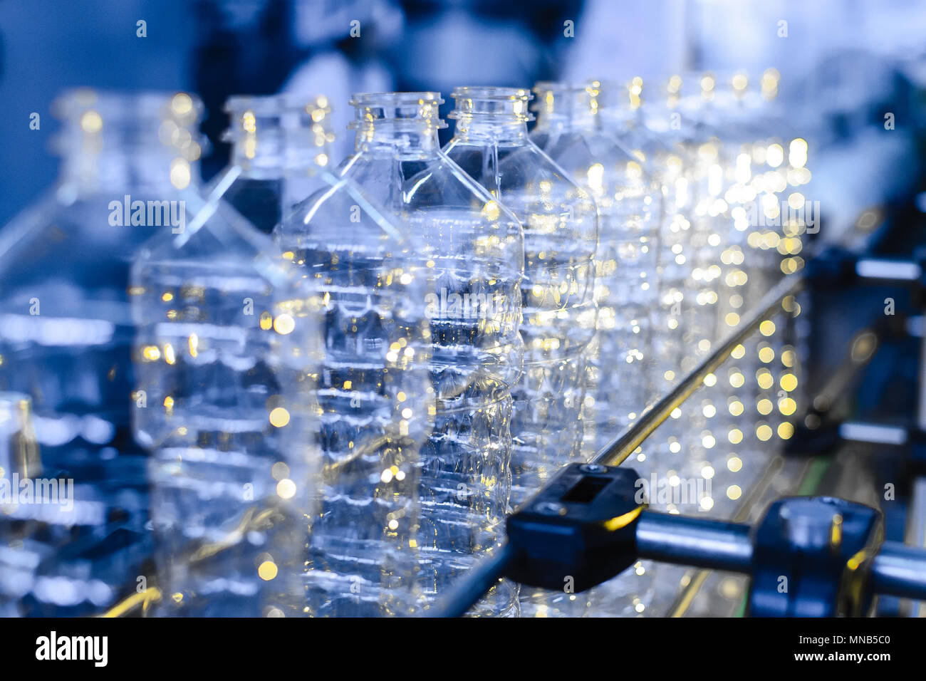 Bottle. Industrial production of plastic pet bottles. Factory line for ...