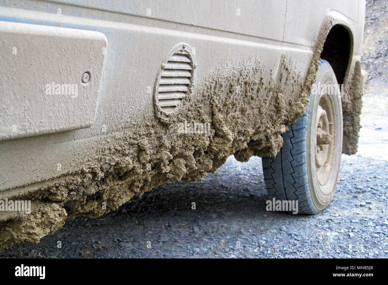 Very dirty muddy van after driving the endless Dalton Highway leading ...